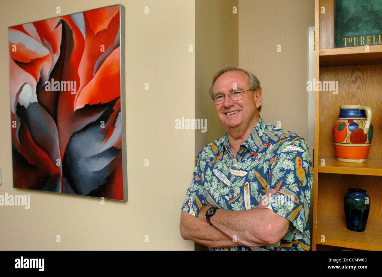 Peter Bedford poses with a Goergia O'Keefe original Tuesday, June 15 ...