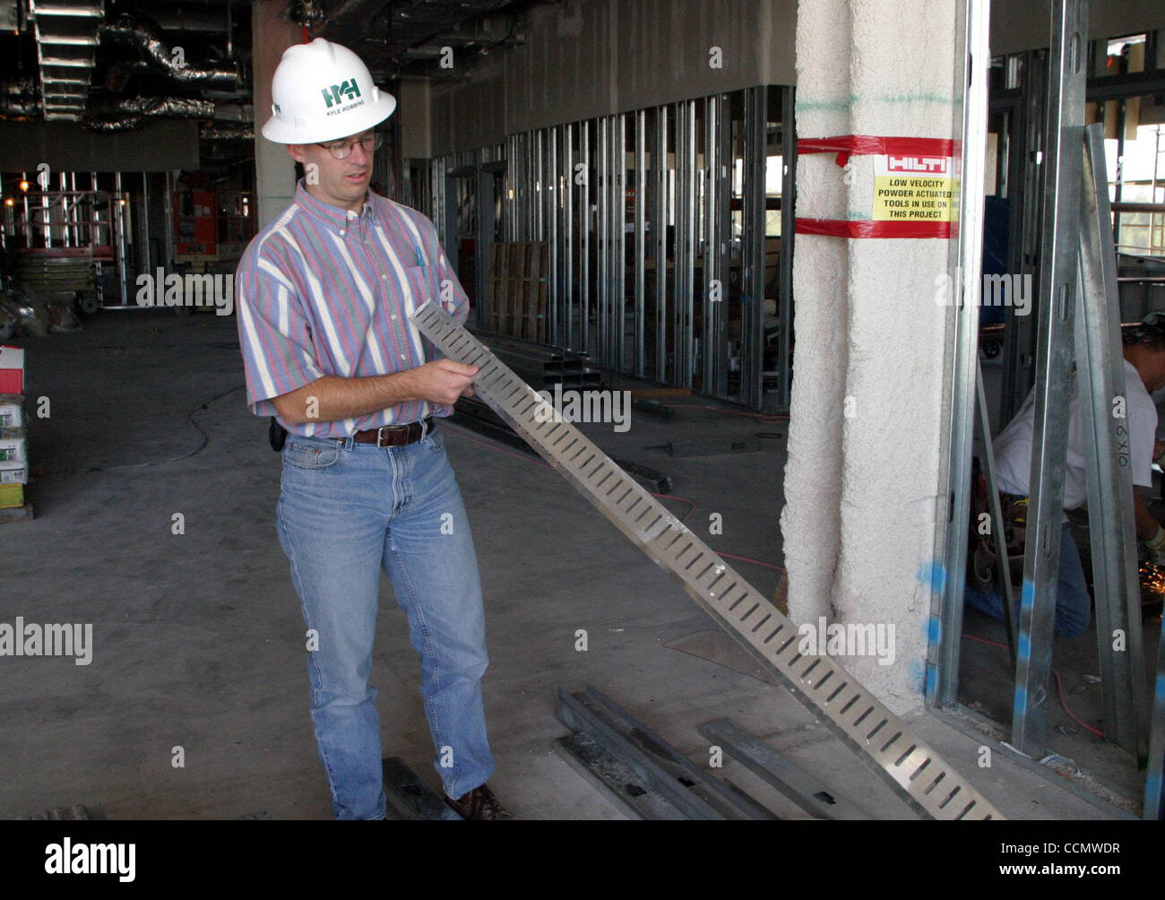 Kyle Robbins (cq), of HMH builders, shows a slip track in the new ...