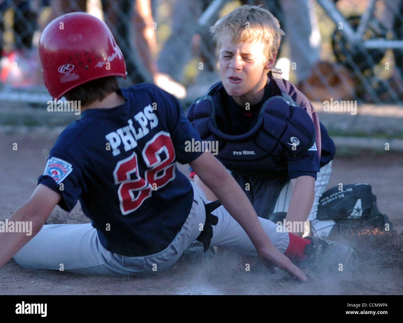 (L TO R) Robby Phelps of Alemeda slides in at home as Mike Wright of ...