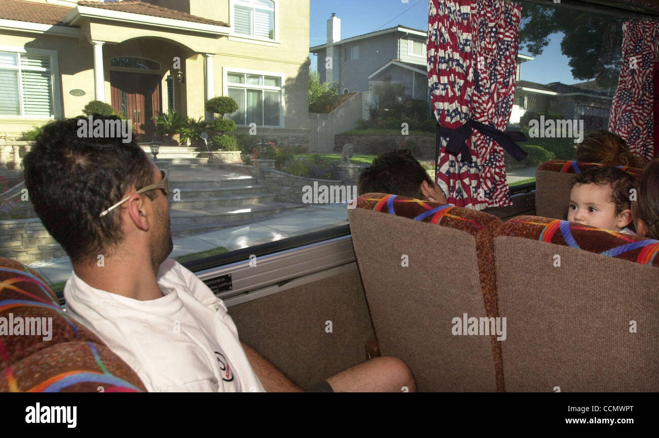 Martin Ramirez and his family, rides a tour bus through the streets of ...