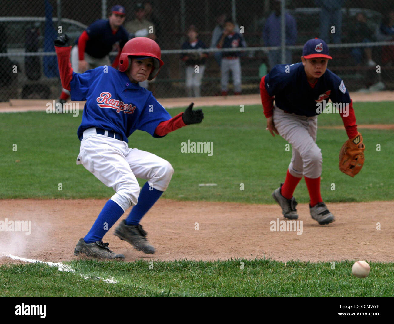 (Left to right) South Oakland Rangers Pat Cody-Carese safely gets to ...
