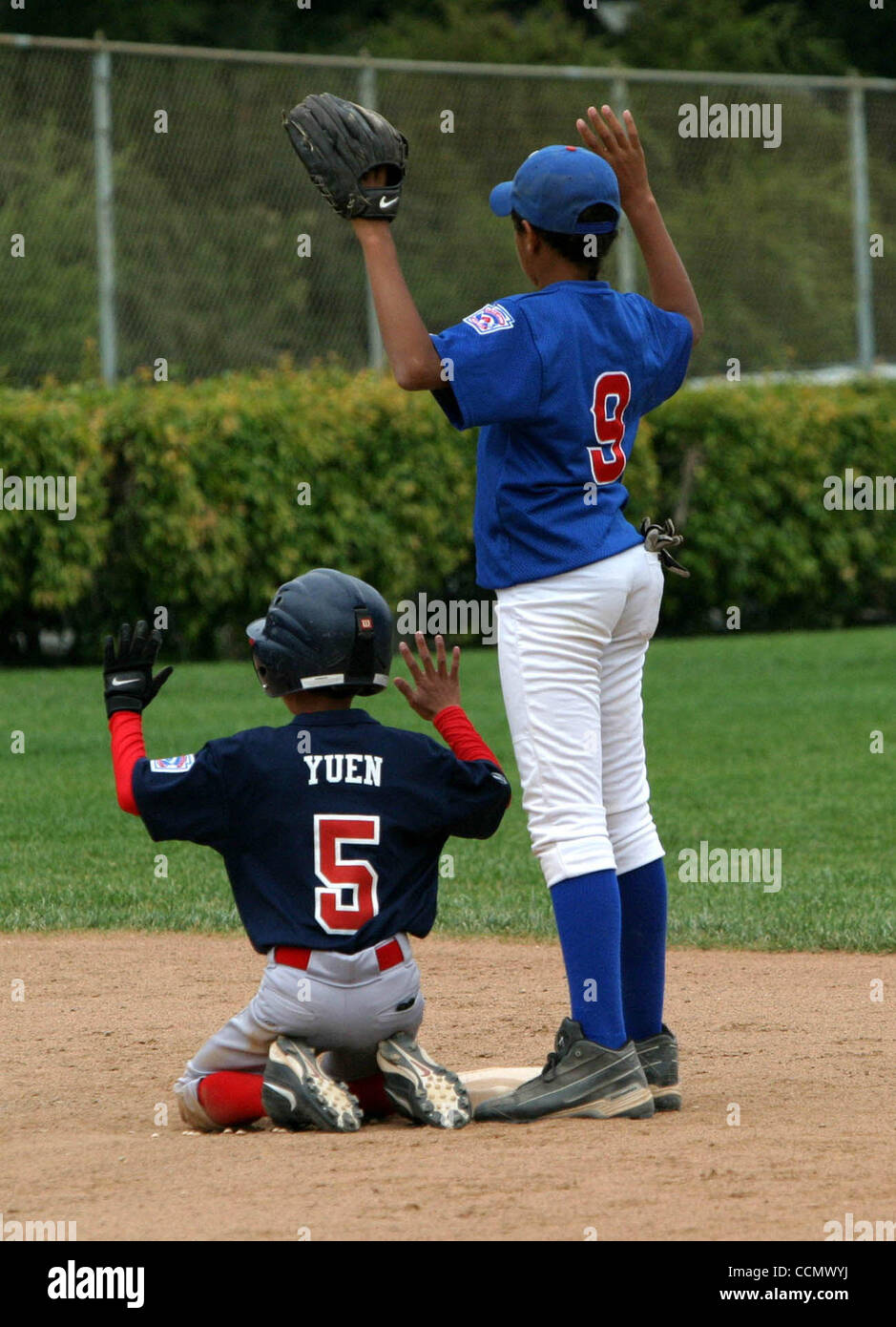 (Left) Alameda Indians Josh Yuen steals second base and raises his ...