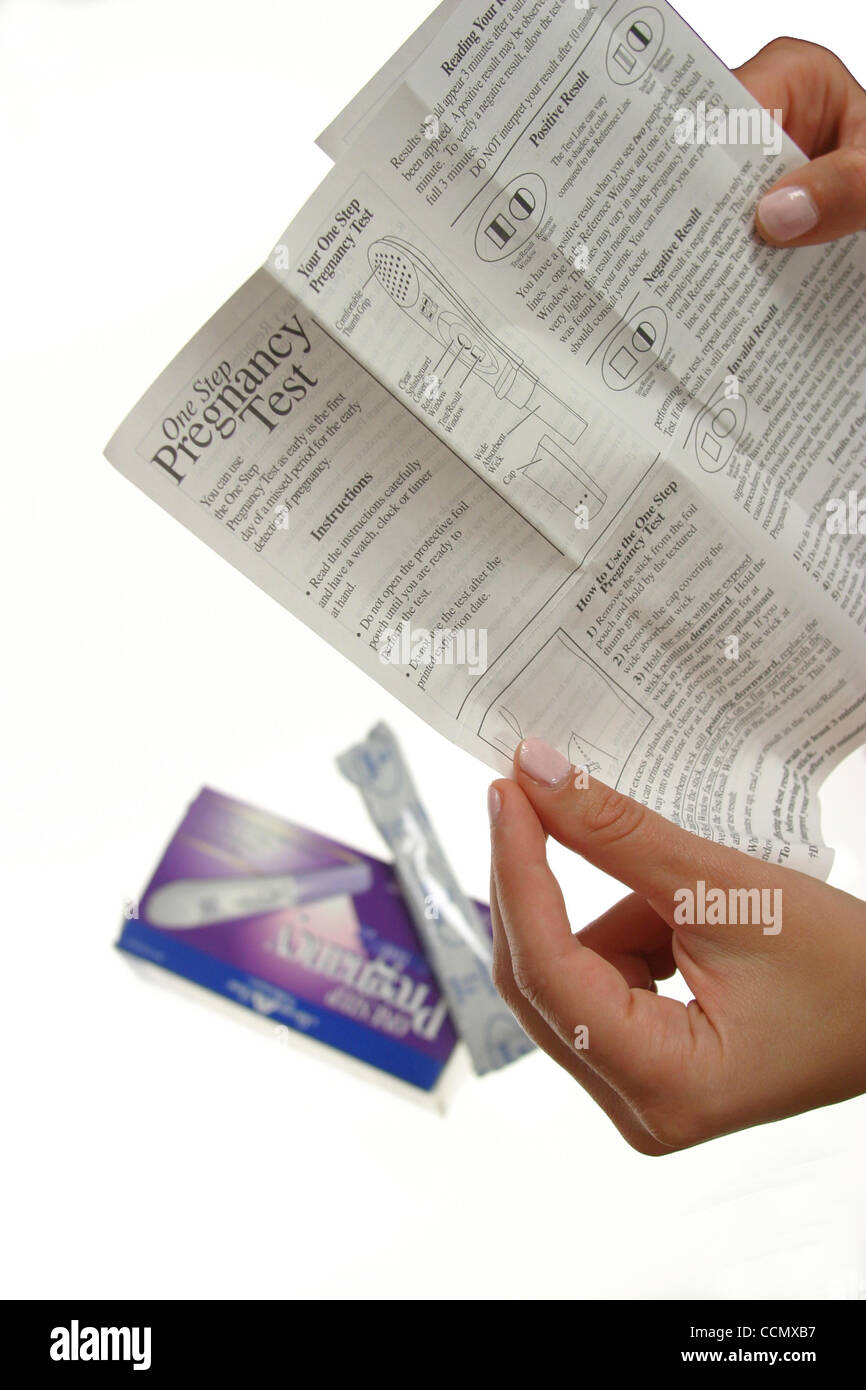 Jul 02, 2004; Laguna Beach, CA, USA; Woman opens and reads instructions ...