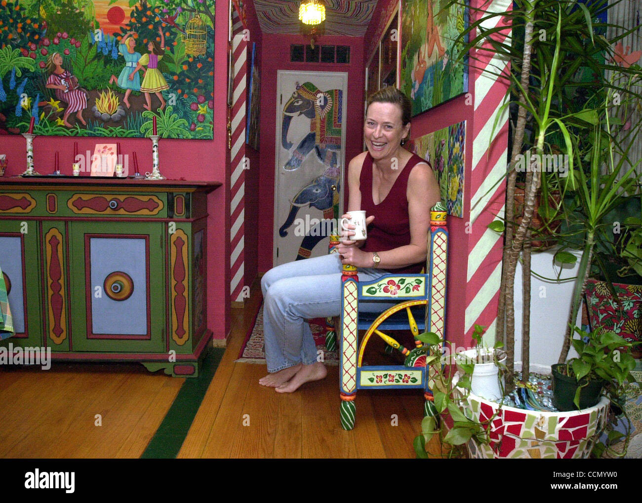 Artist Ann Allen enjoys a light moment July 7, 2004, in the entry of ...