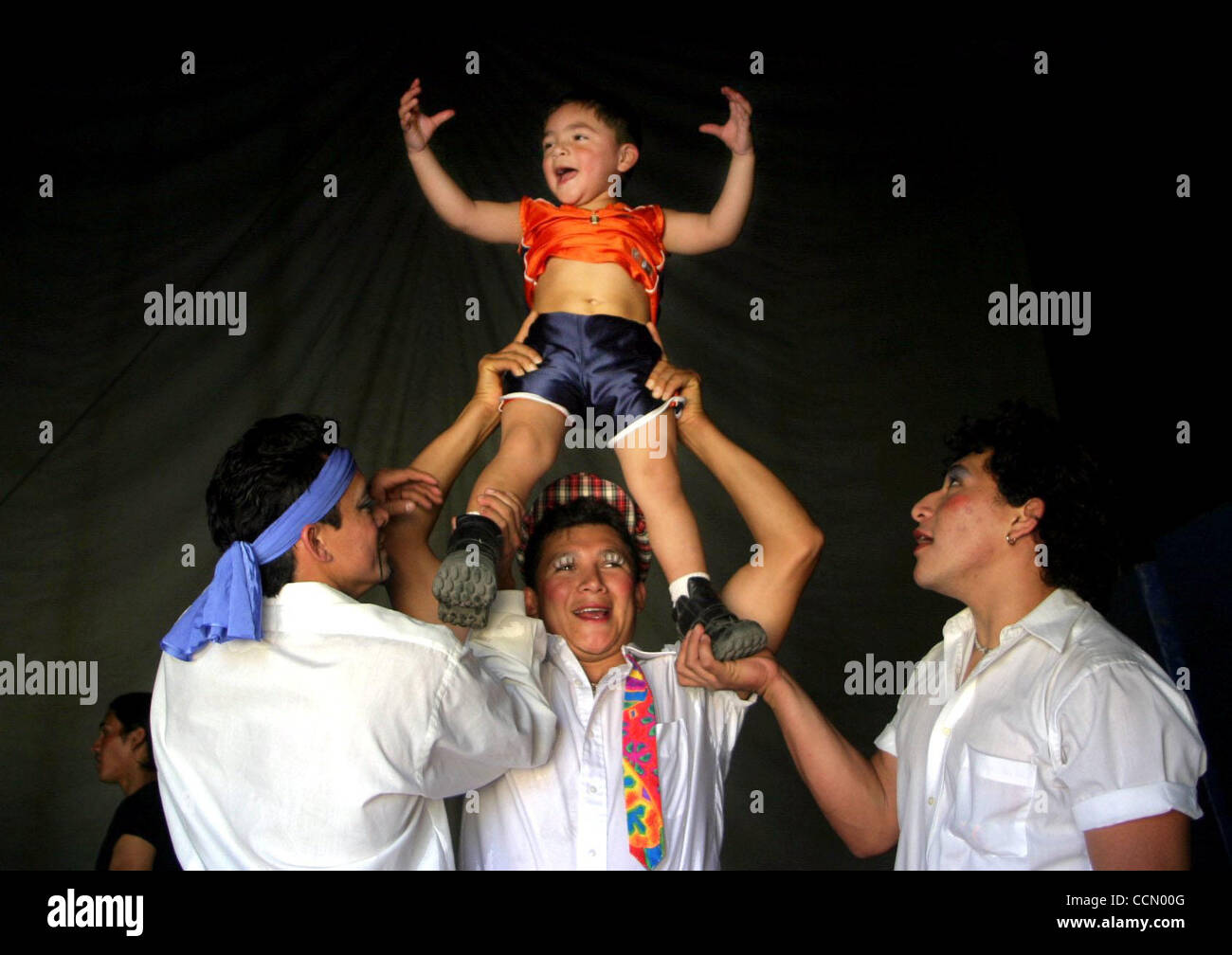 (BOTTOM RIGHT ON PHOTO PAGE) Axel Chimal (cq)(top), 2 years-old, hangs ...