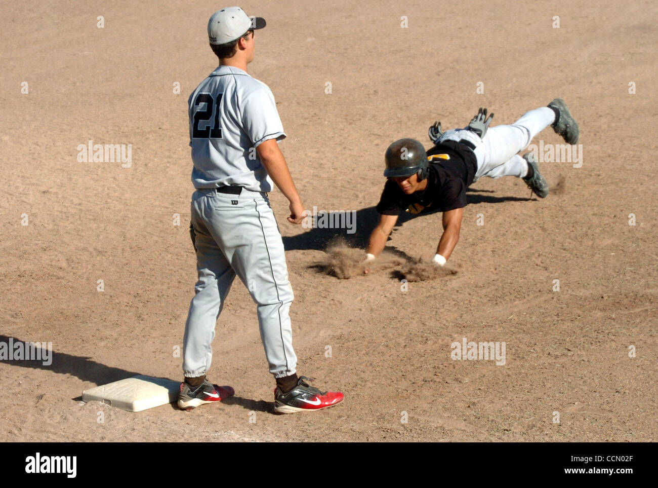 Antioch's Bubba Comages (cq) according to line up)(right) dives safely ...