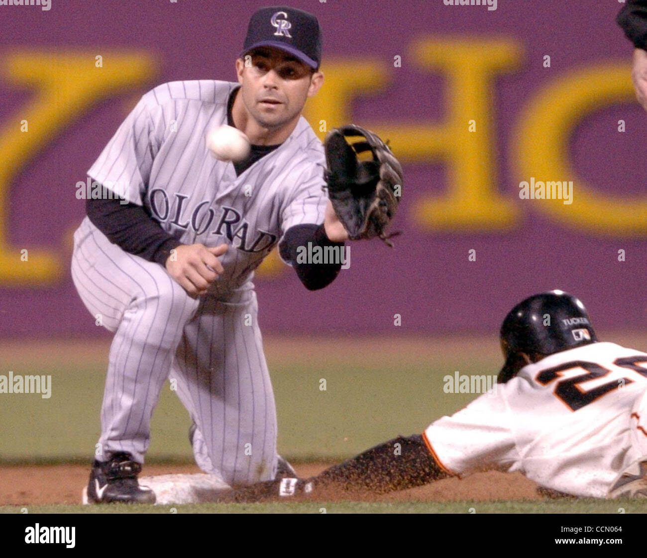 Aaron Miles of the Rockies can't get Michael Tucker of the Giants for ...