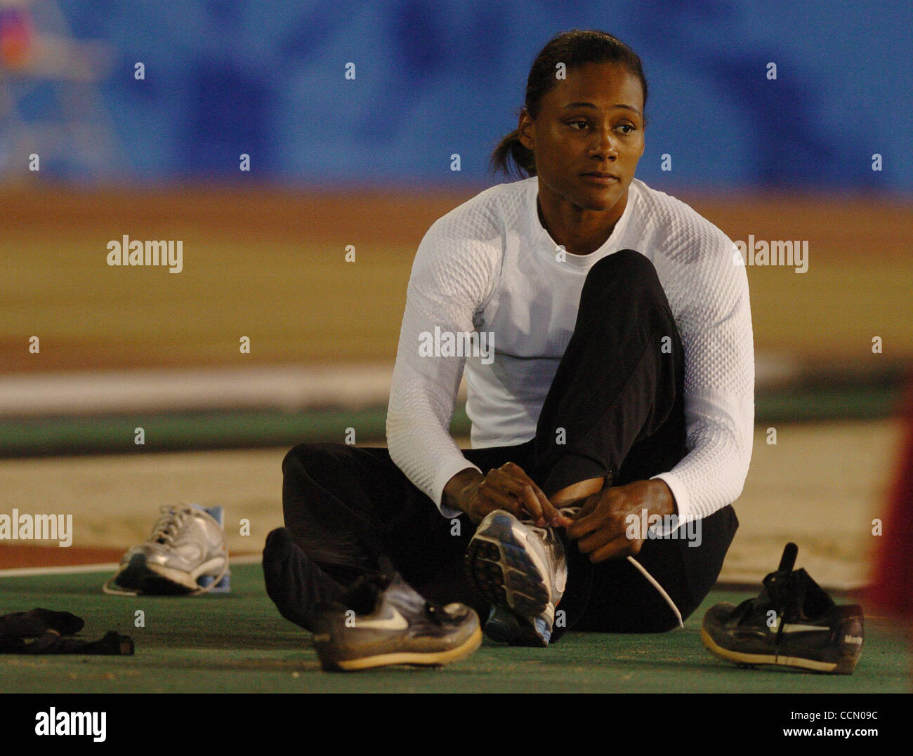 Marion Jones packs up for the night after competing in the Women's Long ...