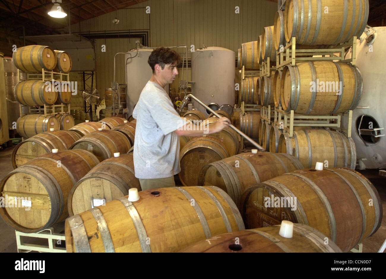 Bob Padgett of Mokelumne Mobile Bottling places the wand in another ...