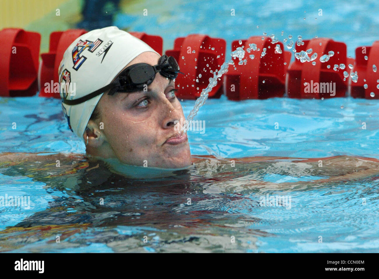 Amanda Beard squirts a stream of water after seeing her time, 2nd best ...