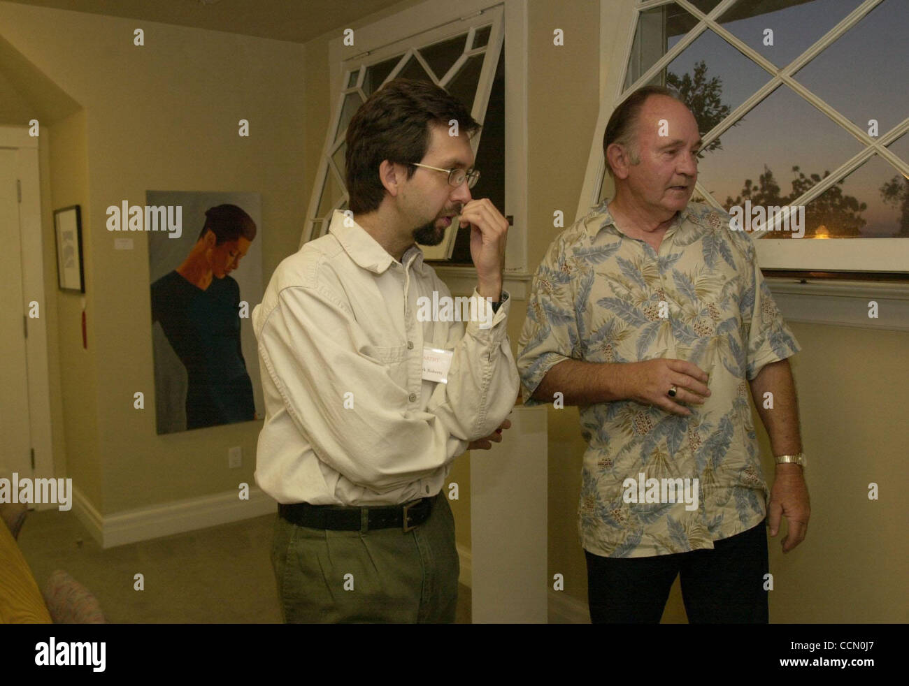 (L-R) Artists Mark Roberts (cq) and Ken Tomlin (cq) look over an oil ...