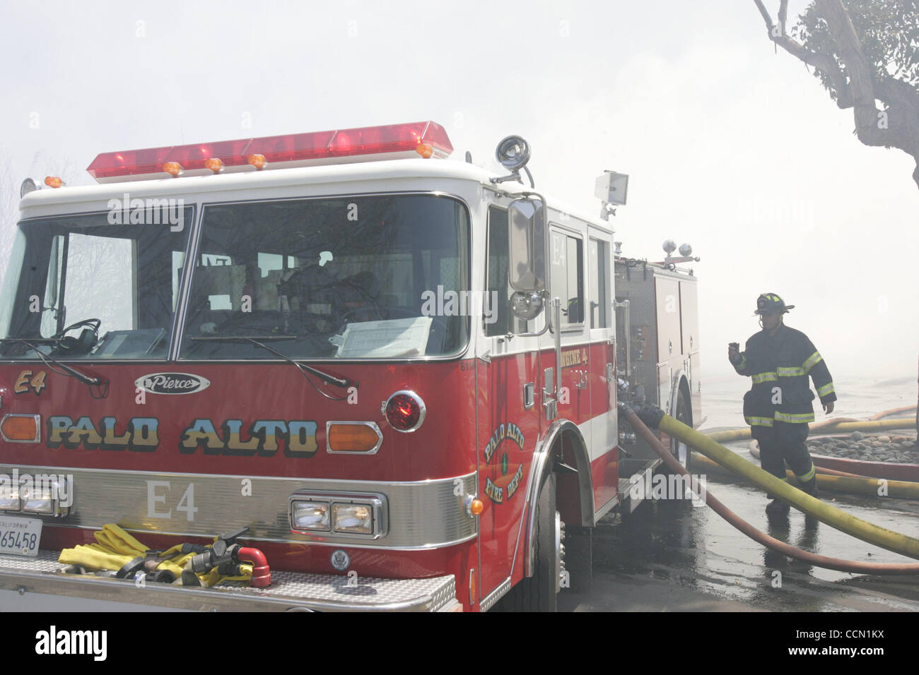A brush fire blazed behind the office buildings of several Silicon Valley companies in the Palo ...