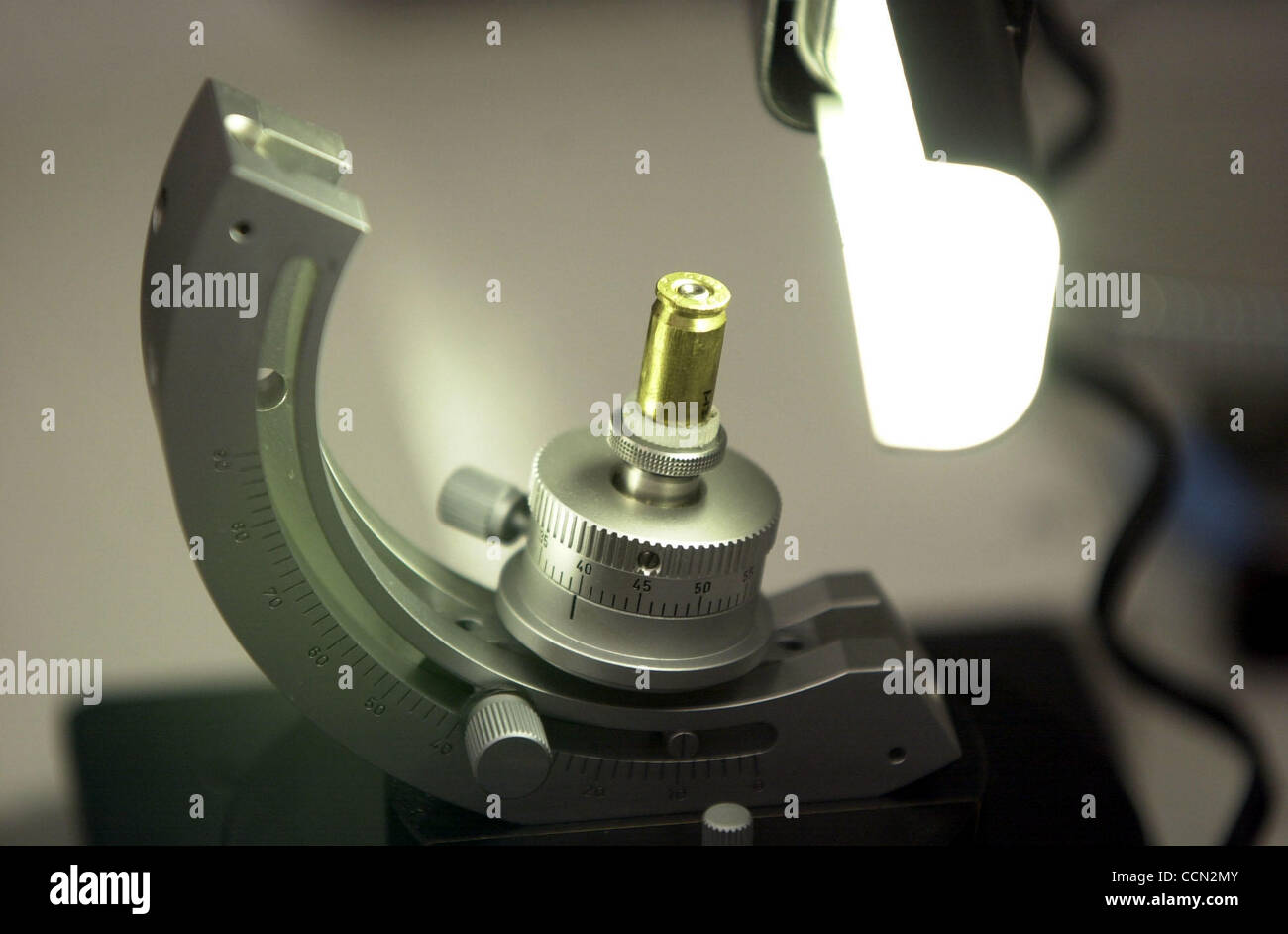 A shell casing is mounted for microscopic inspection Wednesday, July 28 ...