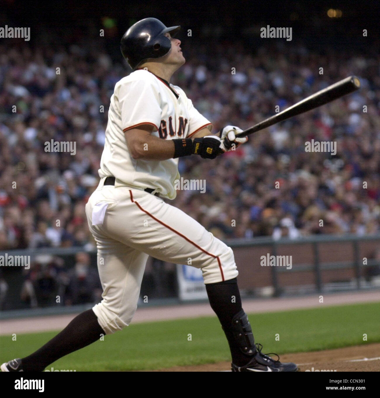 J.T. Snow of the Giants watches his homerun in the second inning ...