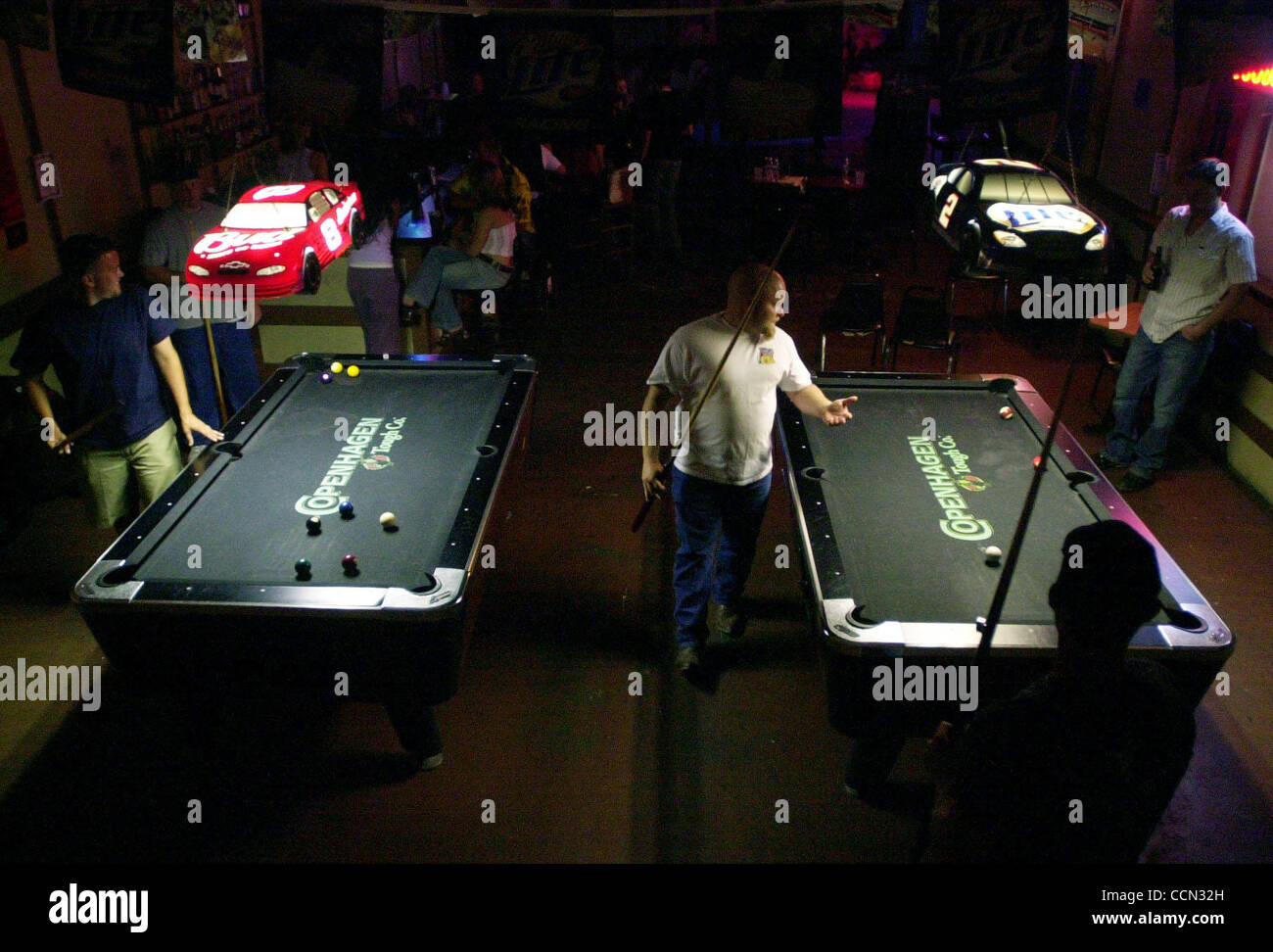 2124--Local residents enjoy night life activities including shooting ...