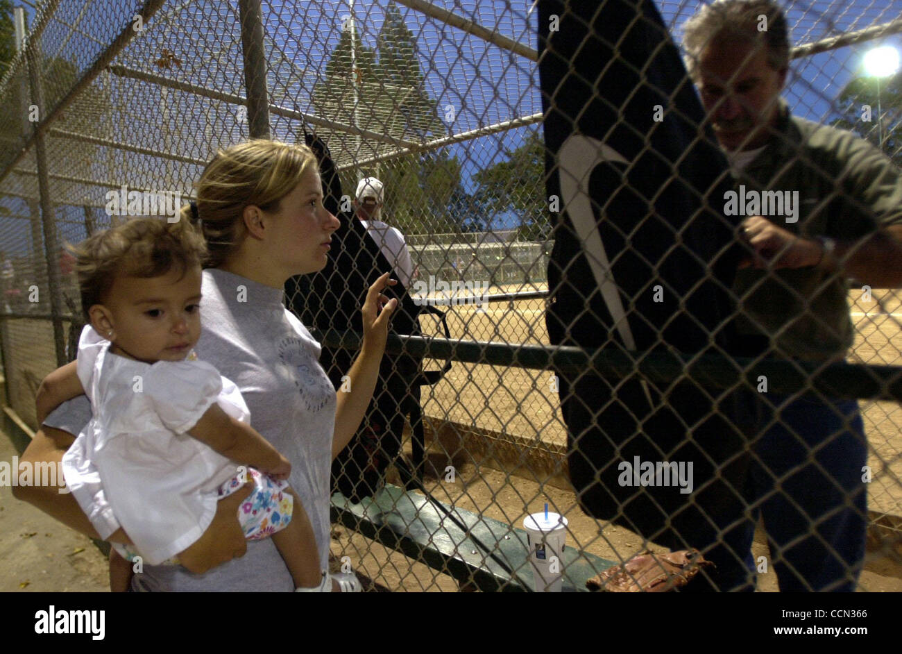 8:48pm... Natalie Moss (cq) holds her neice Elizabeth Moss (cq), 1 ...
