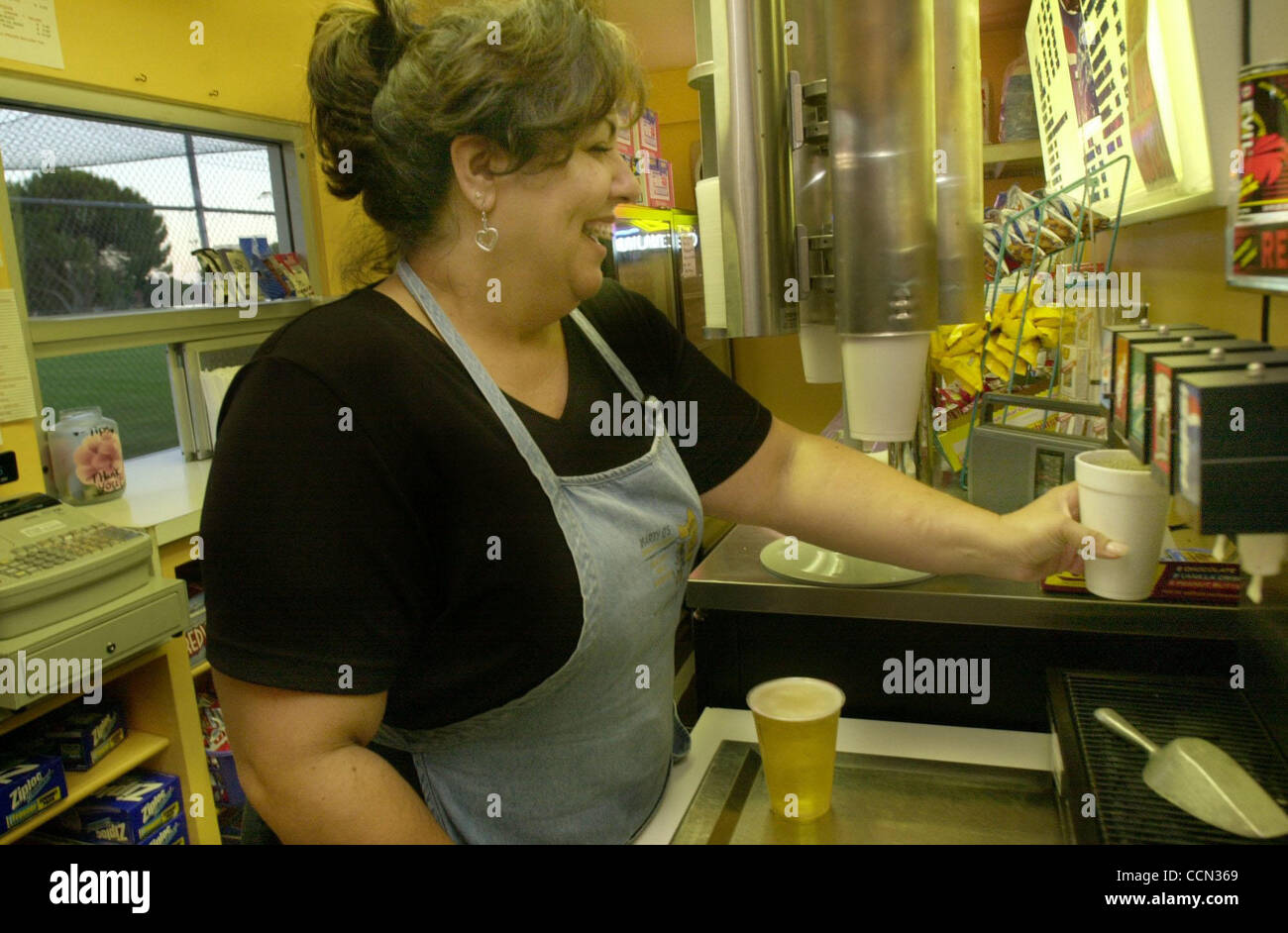 8:22pm... Tami Lim (cq) pours her last soda of the day while working ...