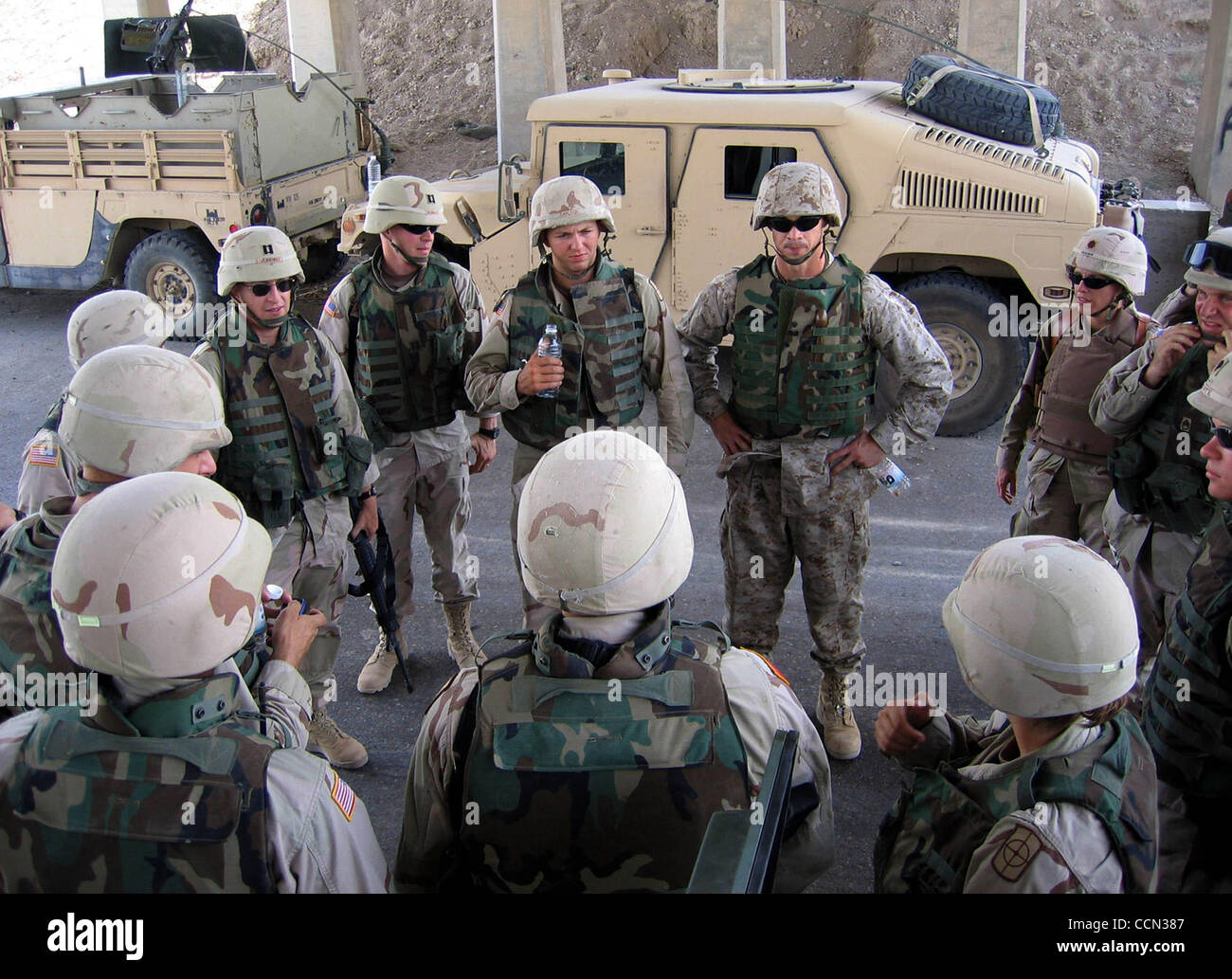 FOR METRO - Marine Lt. Col. Cliff Rees (center, with sunglasses facing ...