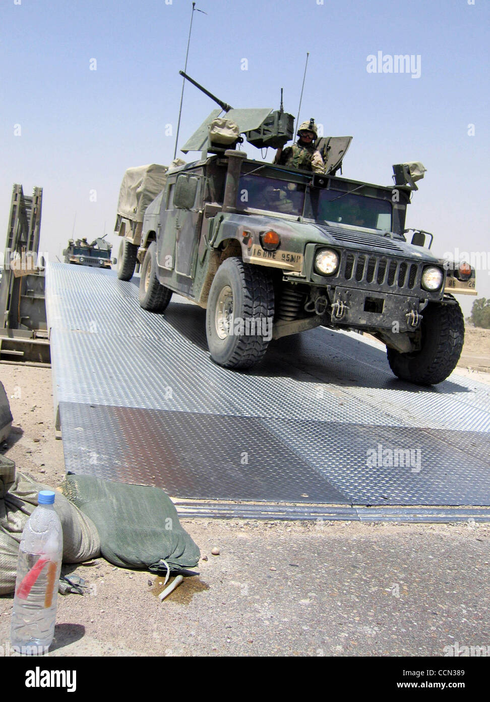 FOR METRO - Humvees roll across a British-made Mabey-Johnson bridge on ...