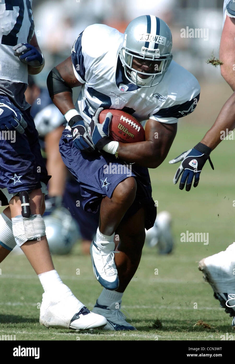 SPORTS- Running back Julius Jones cuts through the line on a running ...