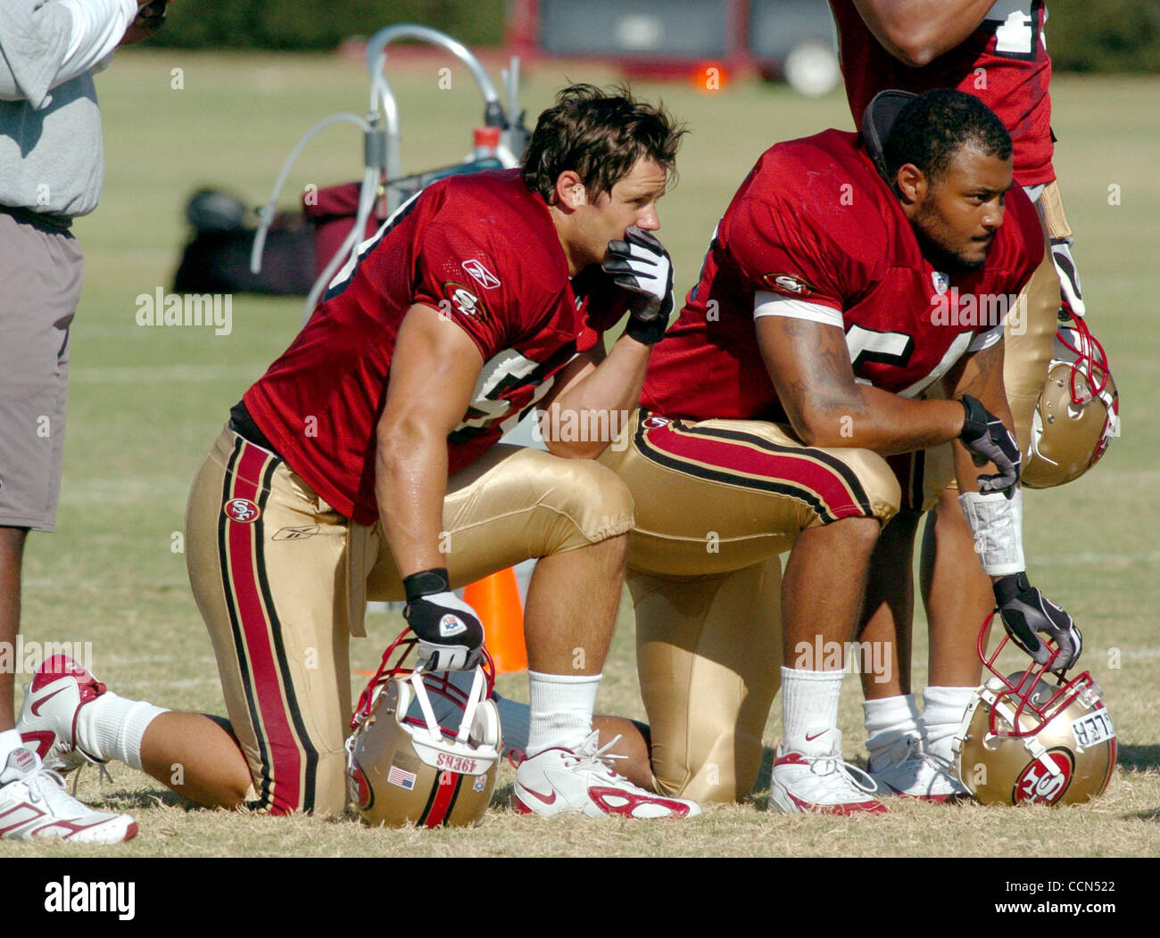 San Francisco Forty Niners Derek Smith, left and Richard Seigler take a ...