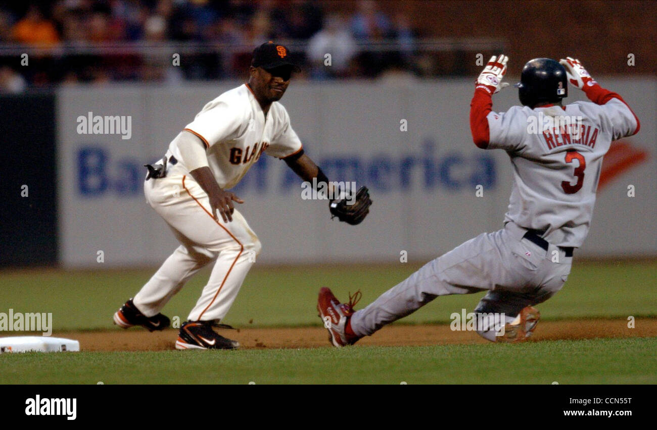 Giants second baseman Ray Durham prepares to tag Cardinal Edgar ...