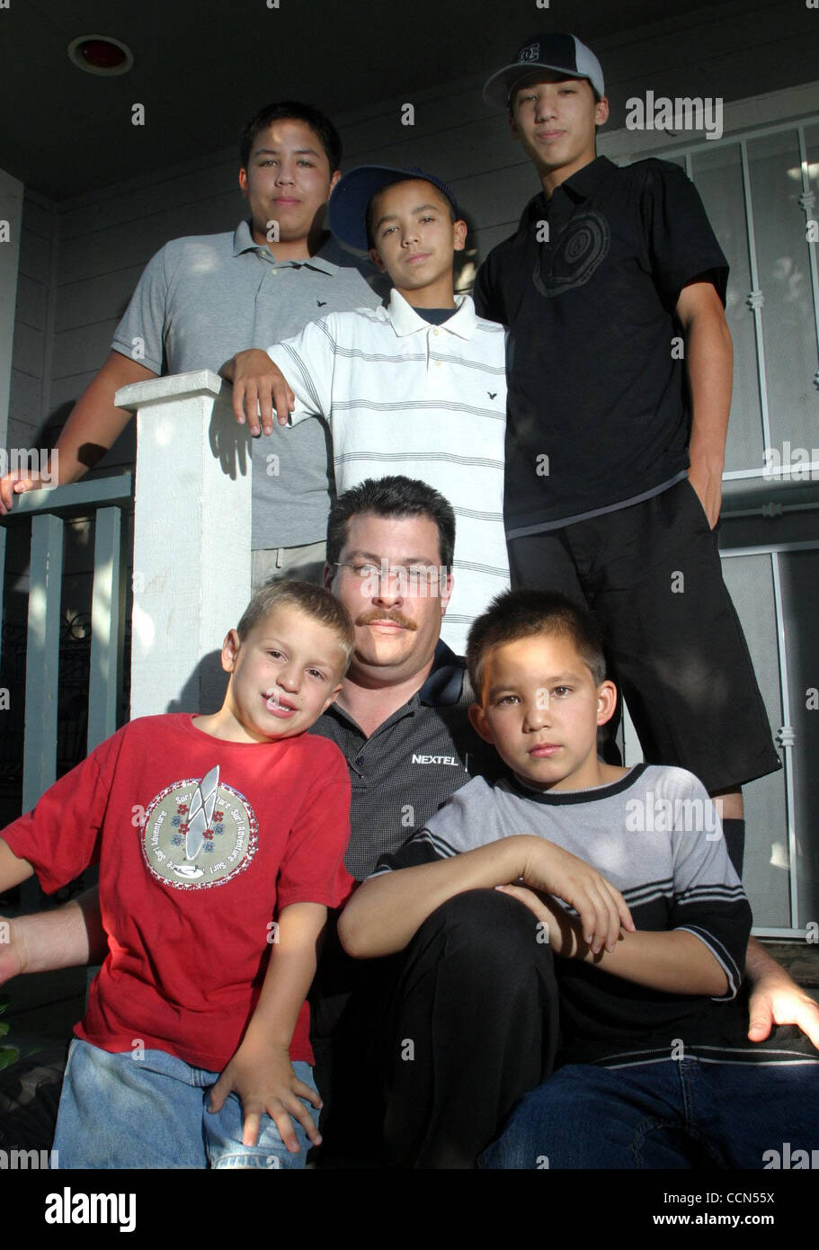 Jeff Altman (cq)(lowe, center) poses with his 5 sons, clockwise from ...