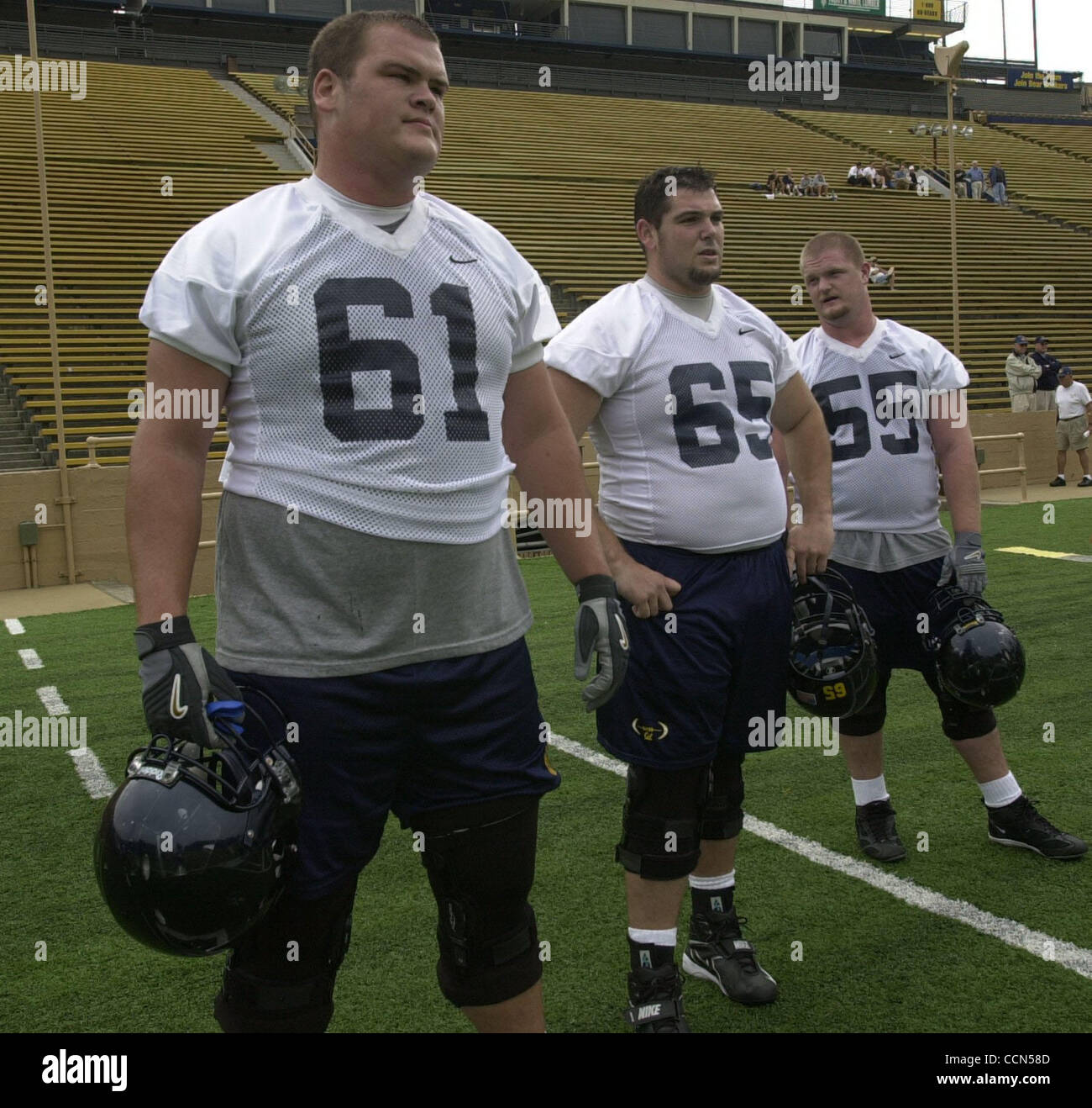 Cal football offensive lineman Ryan O'Callahan #61, Aaron Merz #65, and ...