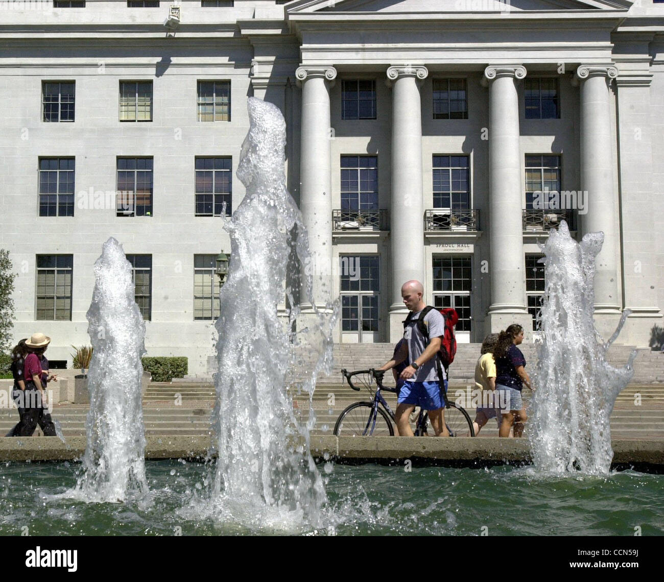 Students walk by Sproul Hall and Ludwig's Fountain as they prepare to ...