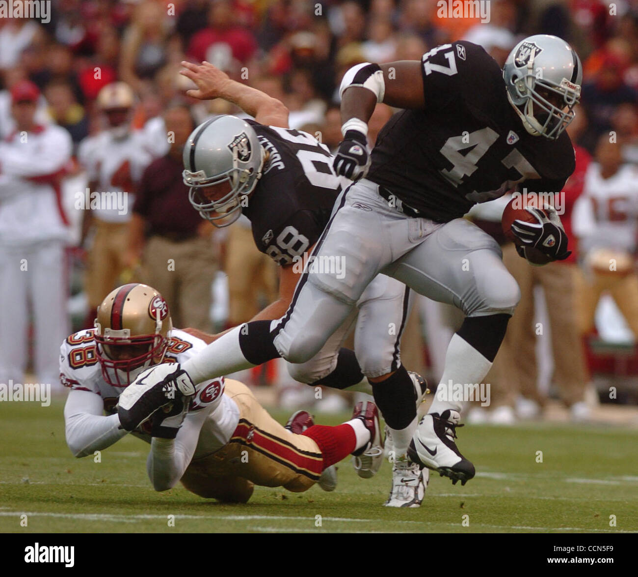 San Francisco 49ers Ronnie Heard, #38, falls to the ground attempting ...