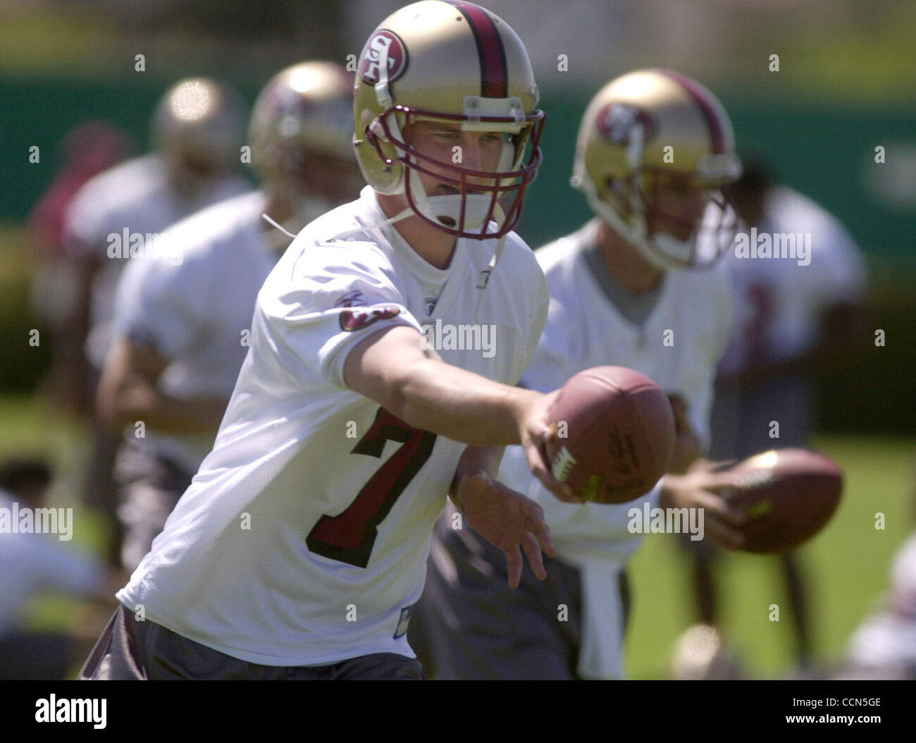 San Francisco 49er quarterback Ken Dorsey hands off the ball on the ...
