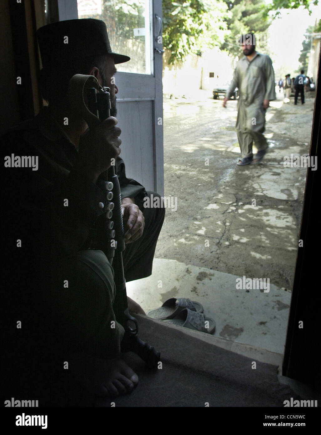 Aug 16, 2004; Kabul, AFGHANISTAN; A Afghan guard stands watch over one ...