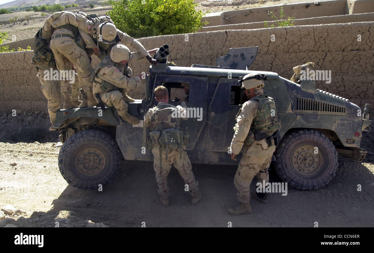 Aug 27, 2004; Kandahar, AFGHANISTAN; US troops mount-up on a Humvee ...
