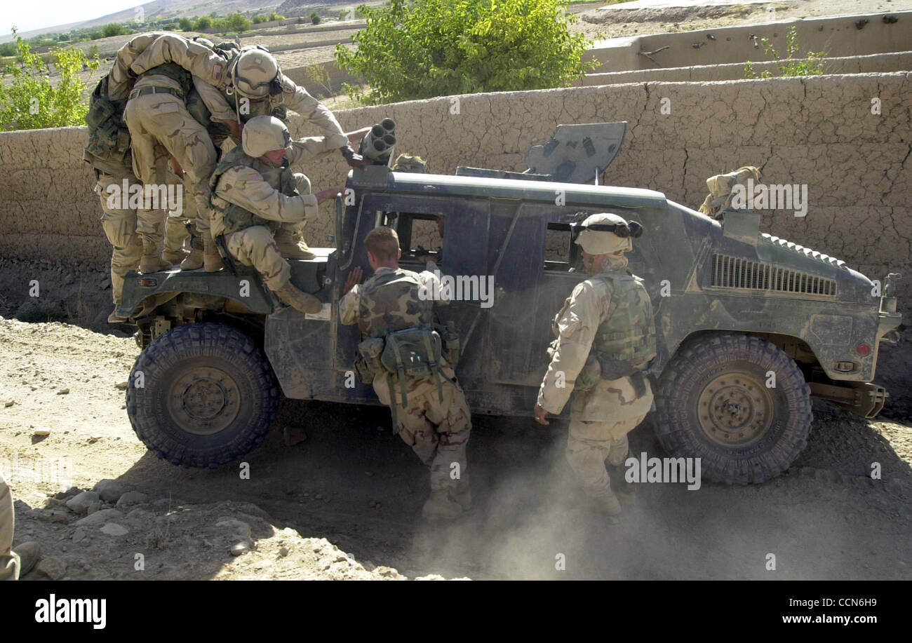 Aug 27, 2004; Kandahar, Afghanistan; US troops and a US Army Humvee ...