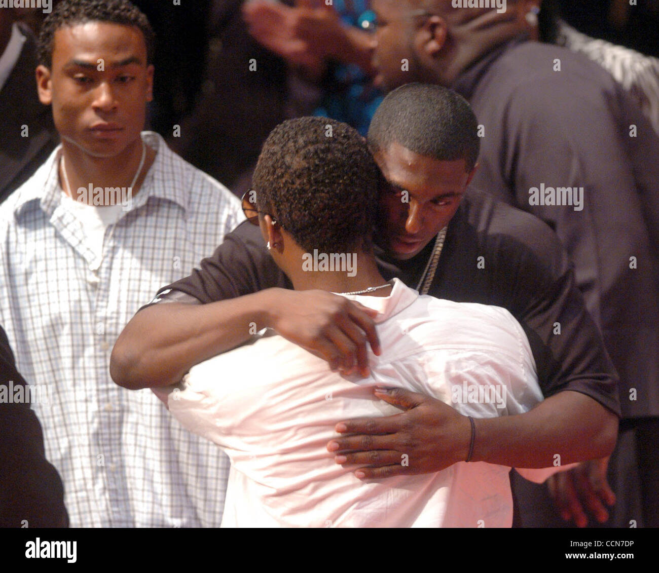 Former De La Salle High School football player Cameron Colvin hugs his ...