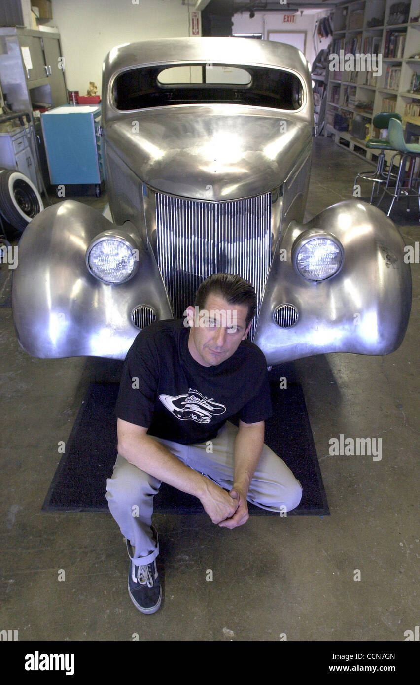 Cole Foster poses Tuesday, August 24, 2004, with the 1936 Ford coupe he ...