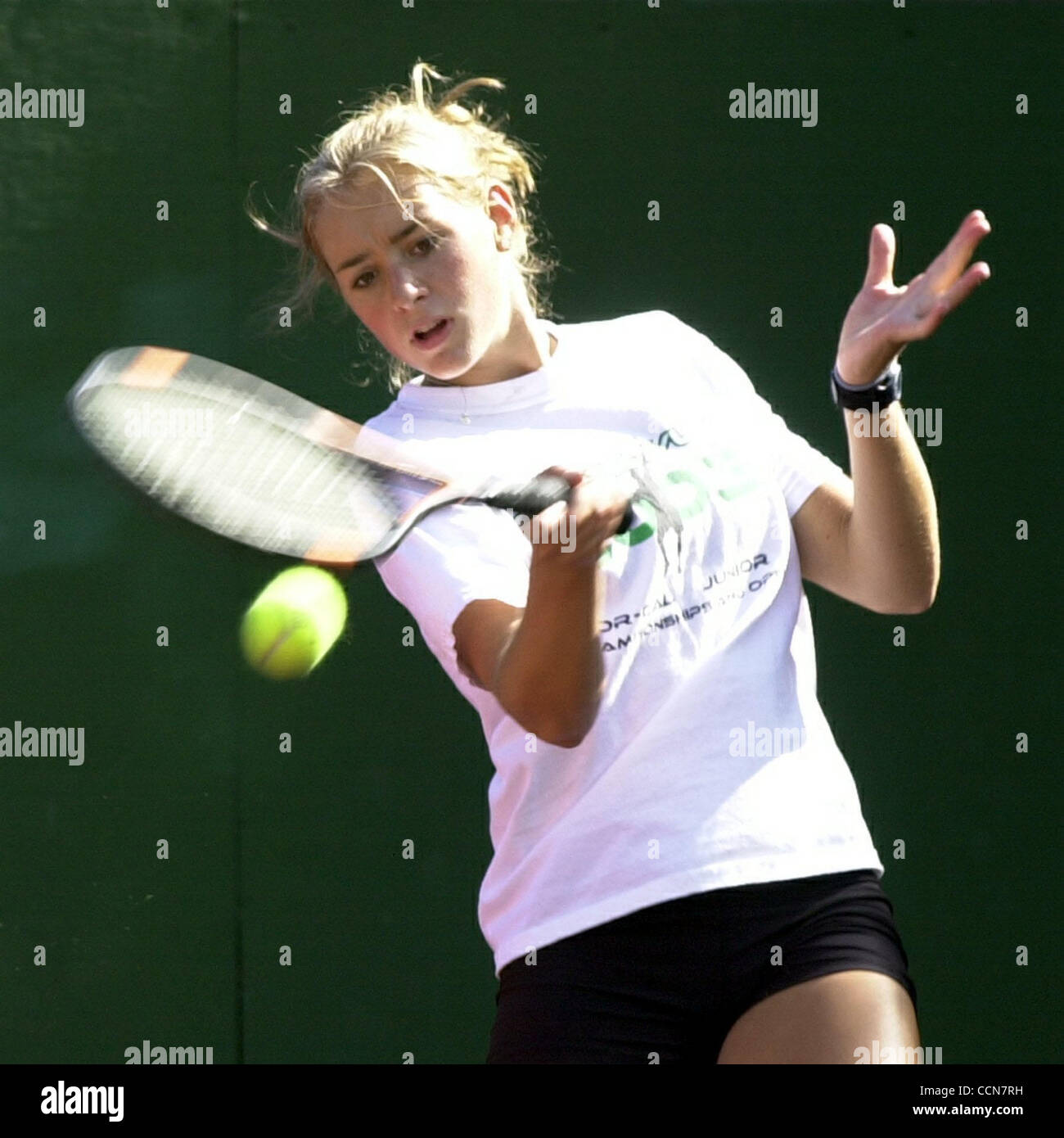 Piedmont High School girls tennis team player Annie Crangle returns a ...