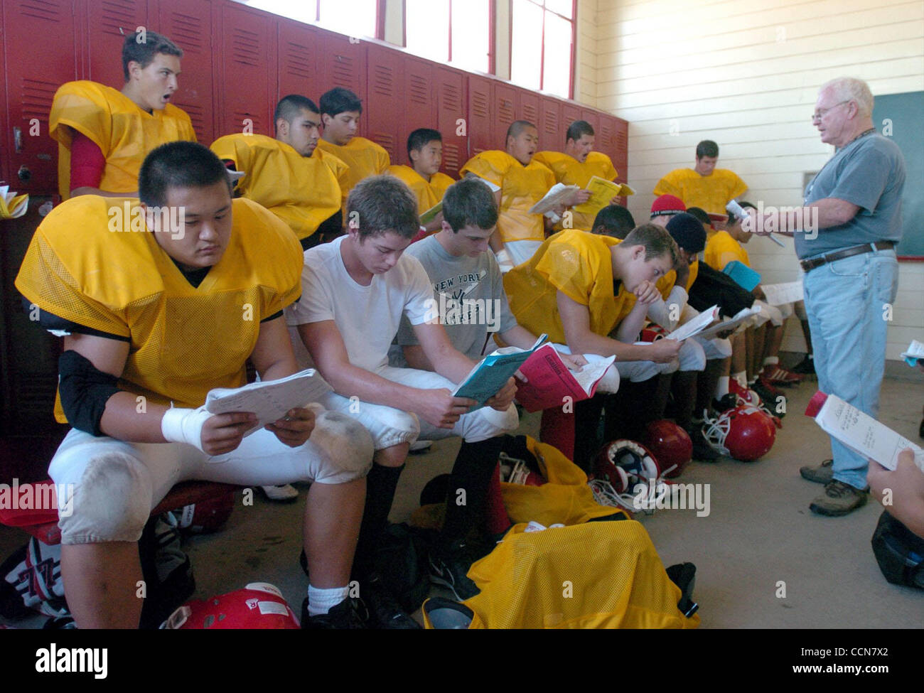 The Albany High players for the Cougars follow along in their football ...
