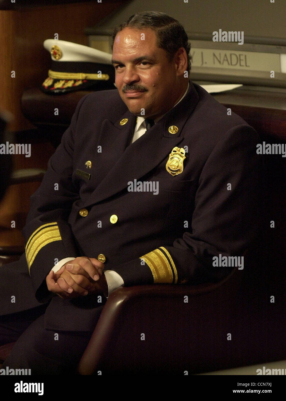 Oakland Fire Chief Gerald Simon listens as speakers praise his work for ...