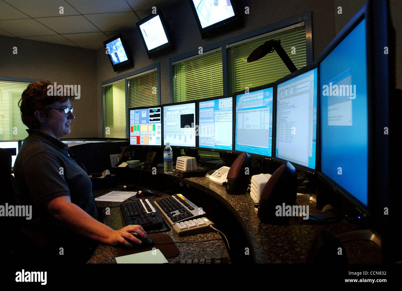 3:38am-- Shelley Muzio , dispatcher and Concord resident, surveys the ...