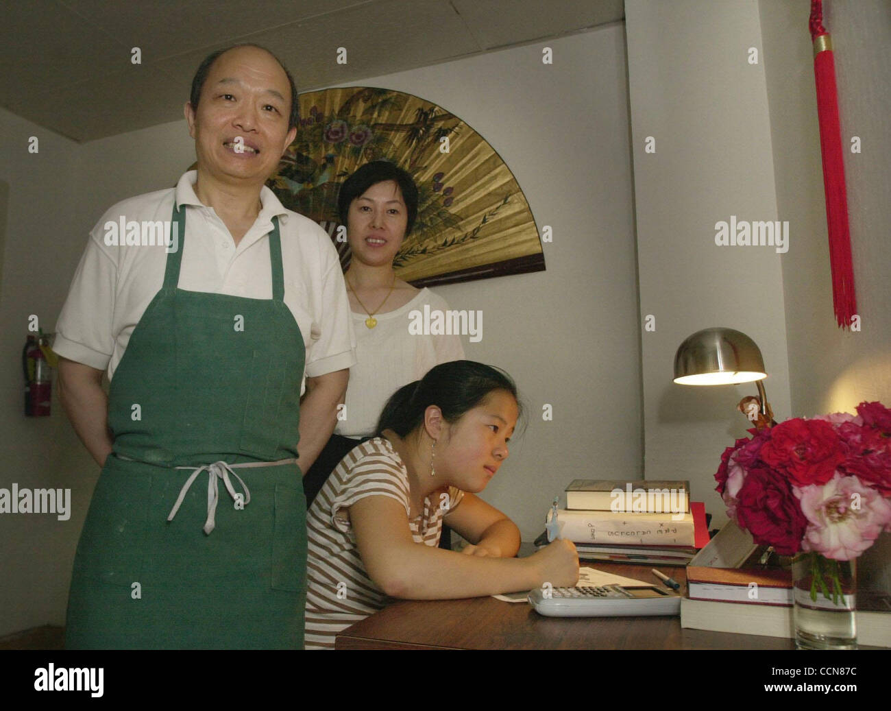 Chef Chen owners and proud parents Danny and Grace Chen (cq) stand as ...