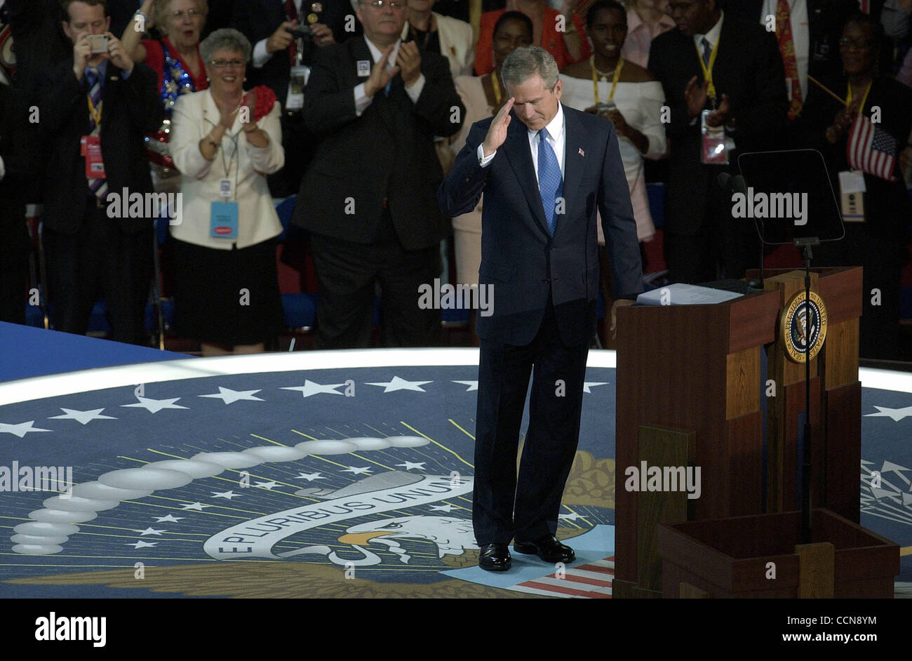 President George W. Bush salutes the Texas delegation as he prepares to ...