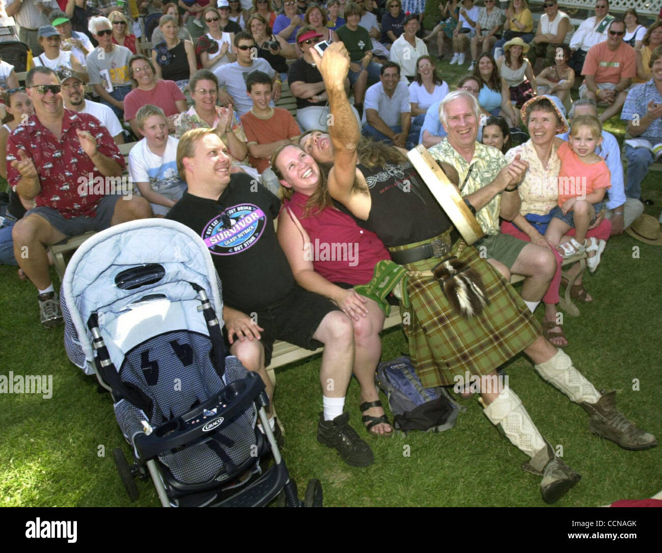 Wayne Belger of the band Wicked Tinkers takes a photo of audience ...