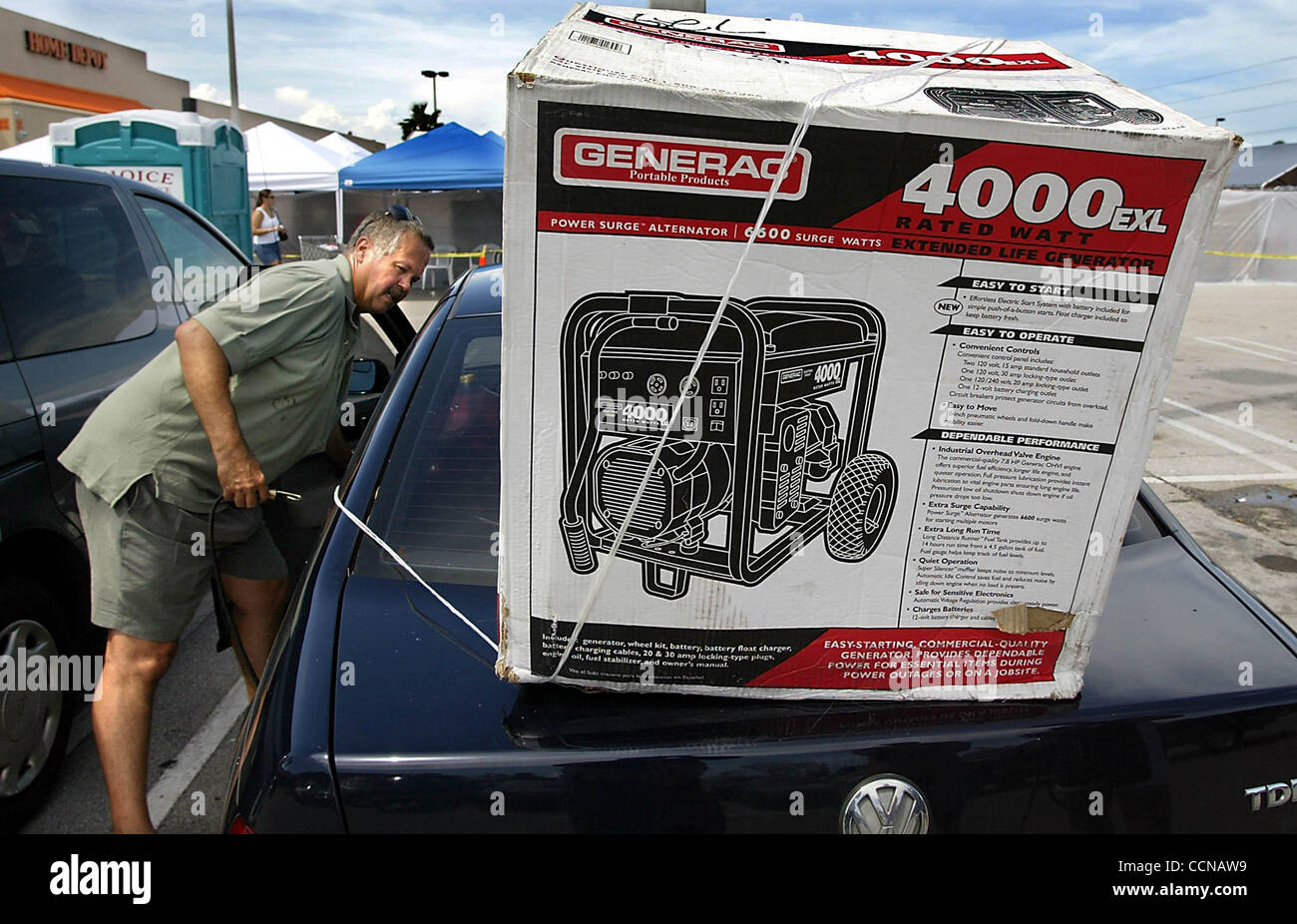 LIVE METRO, STUART, 9/9/04.....Rob Staples, of Port St. Lucie, secures ...