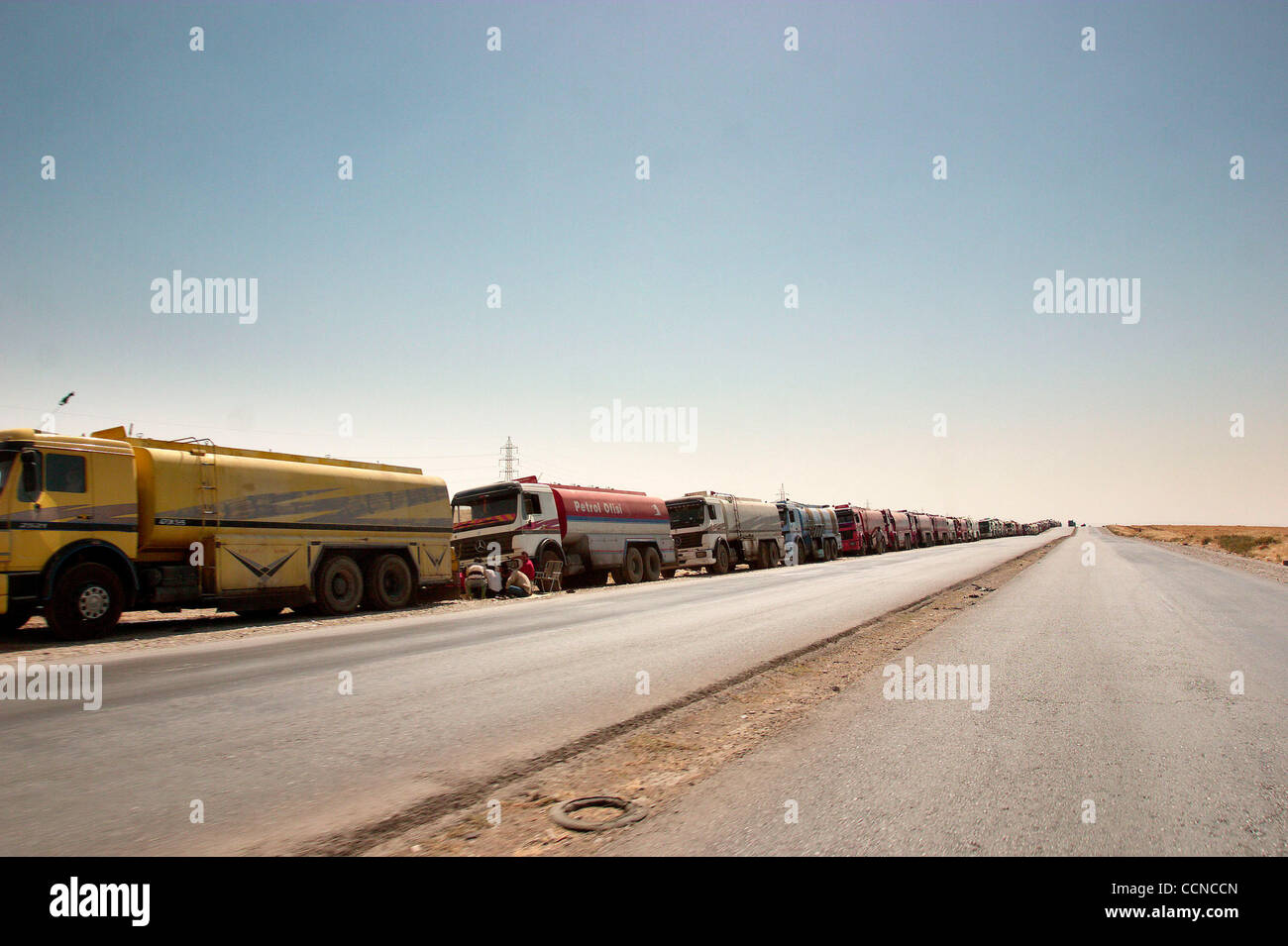 Trucks line the road for 22 km, waiting to cross from northern Iraq ...