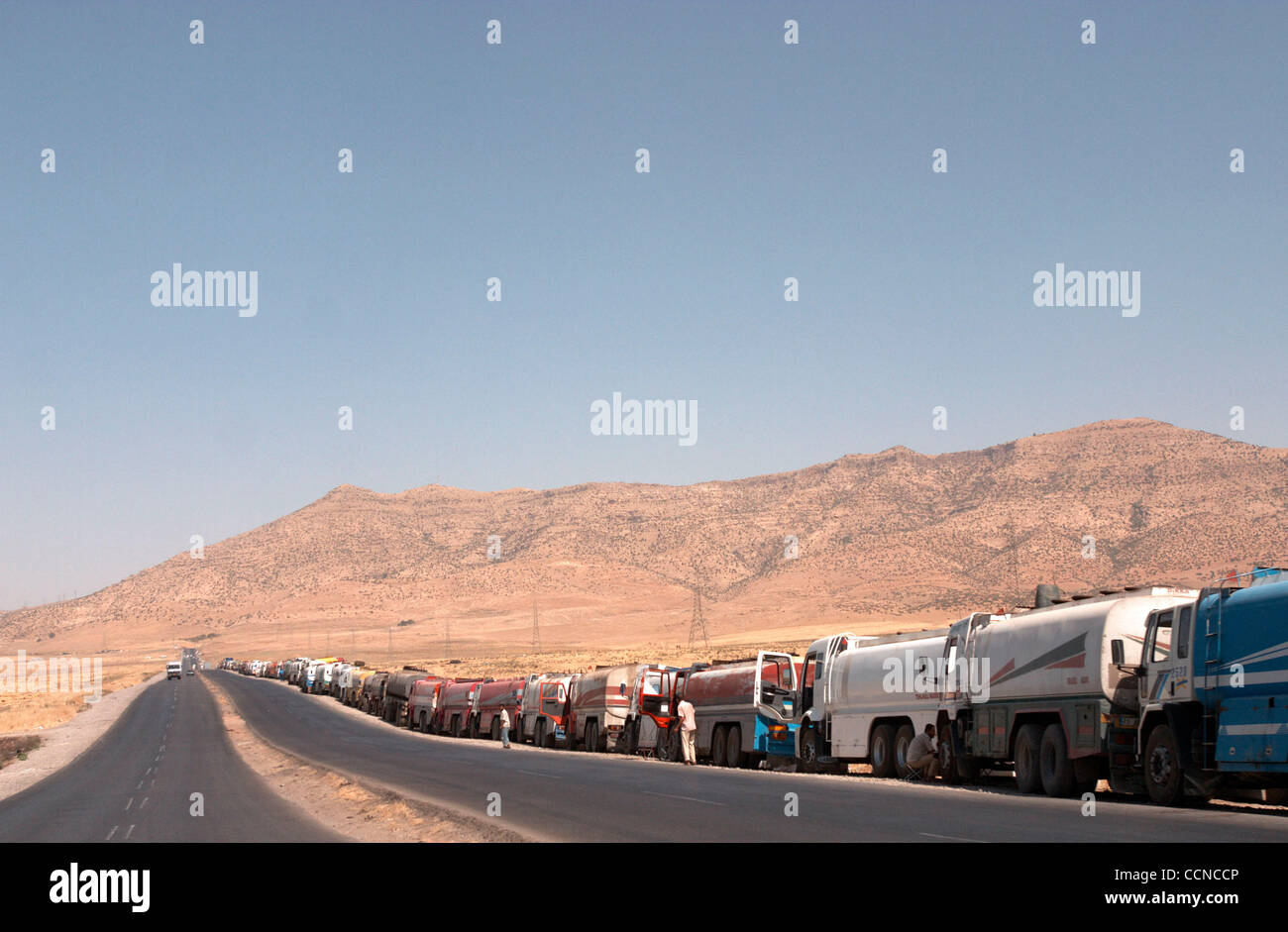 Trucks line the road for 22 km, waiting to cross from northern Iraq ...