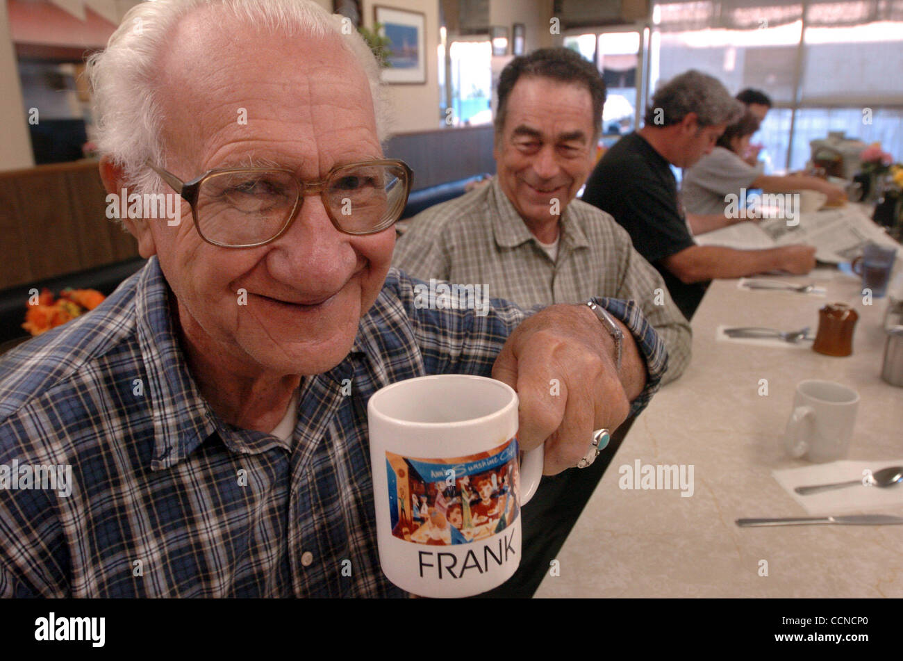 70-year-old Frank Roby of Martinez hoists his personalized coffee mug ...