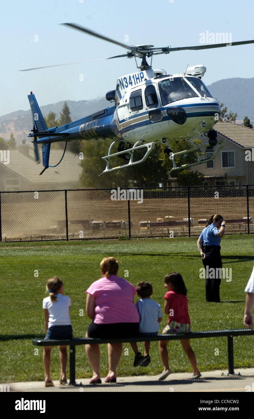 Visitors watch a CHP helicopter land during the Brentwood Kiwanis Club ...