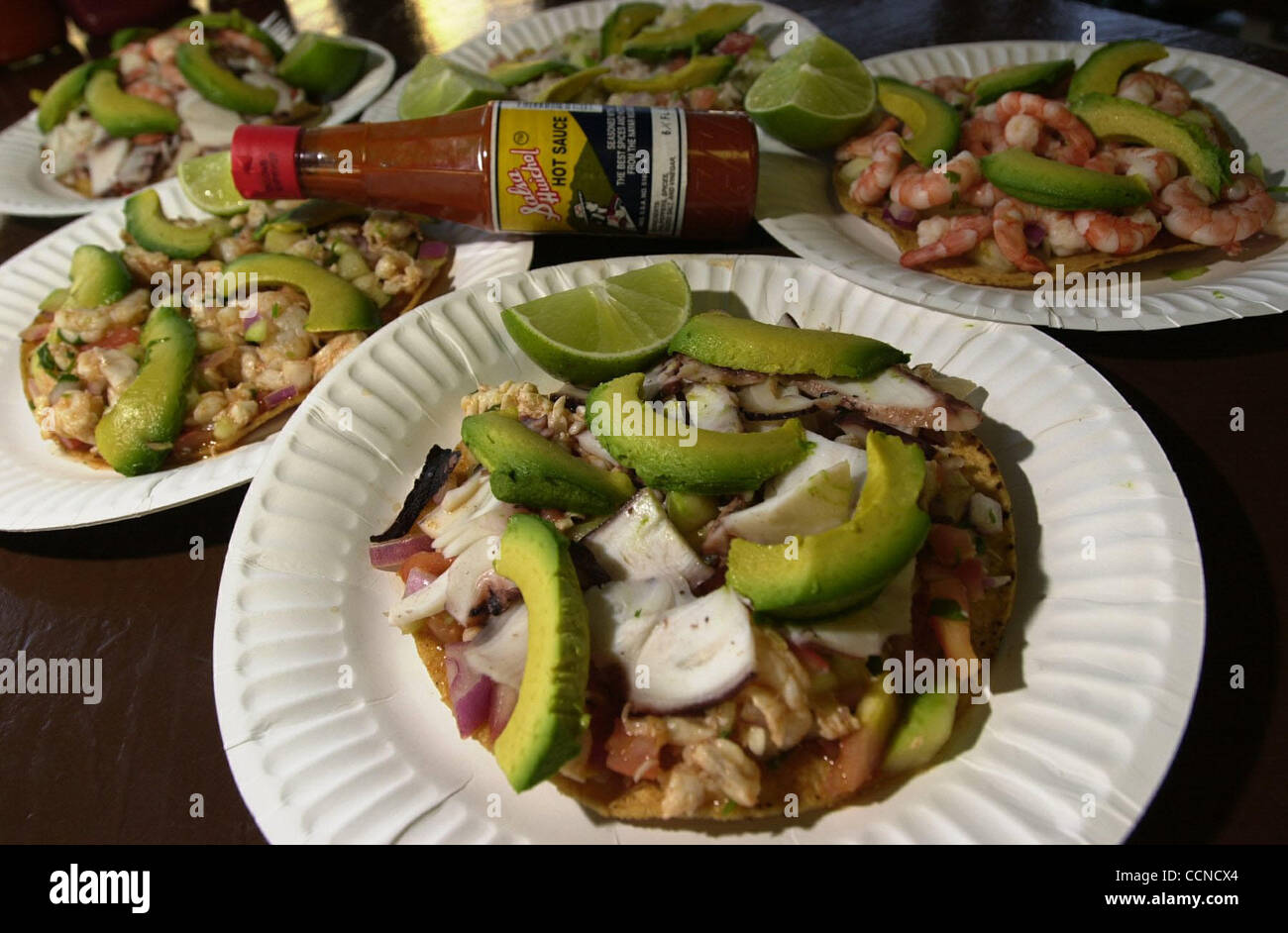 The Tostada Ceviche Camaron y Pulpo, in front, along with other types ...