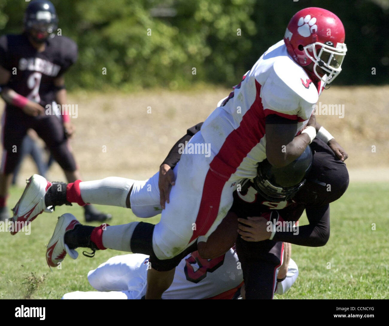 Josh Tatum and Adam Marvin of Saint Mary's High hit Ryan Ching of ...